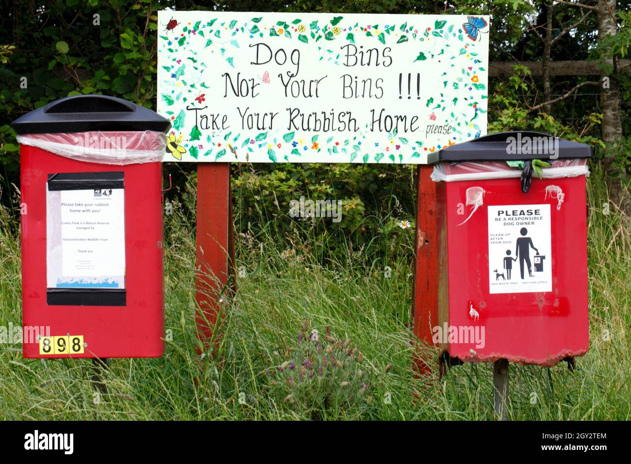 Polite handmade sign by two Dog waste collection bins Stock Photo - Alamy