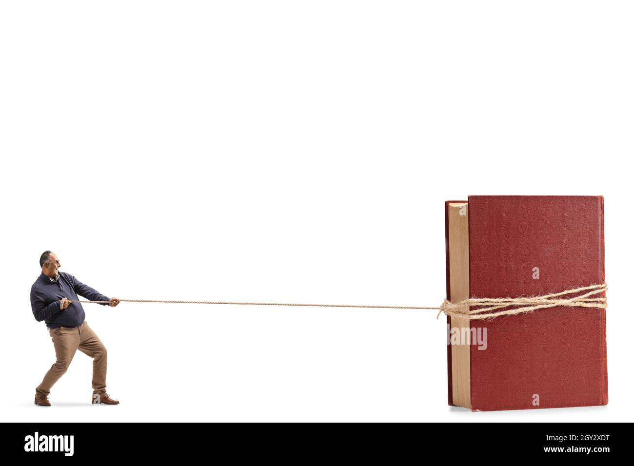 Full length profile shot of a mature casual man pulling a big book with ...