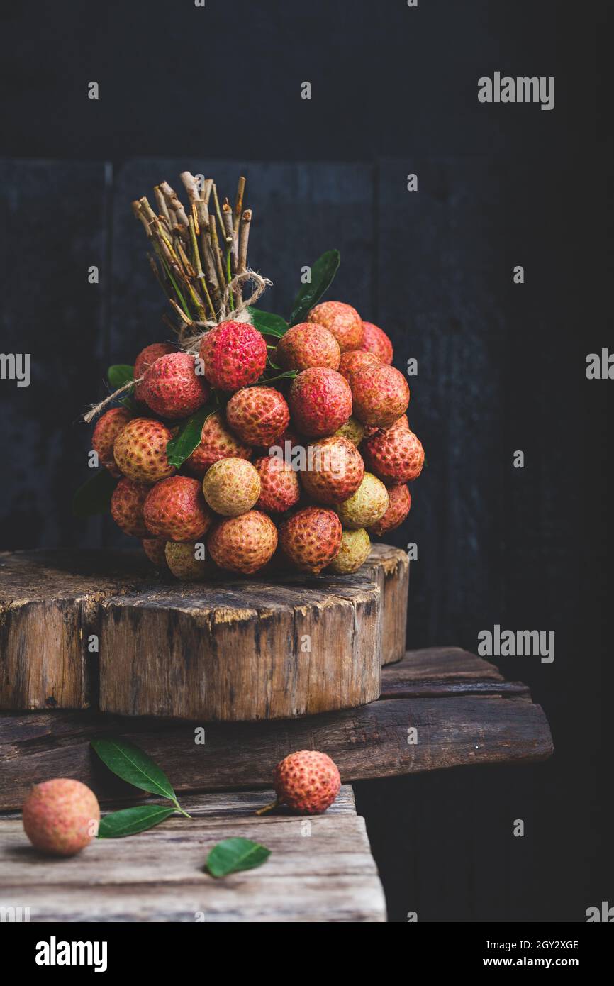Sweet Lychees on a dark black background Stock Photo - Alamy
