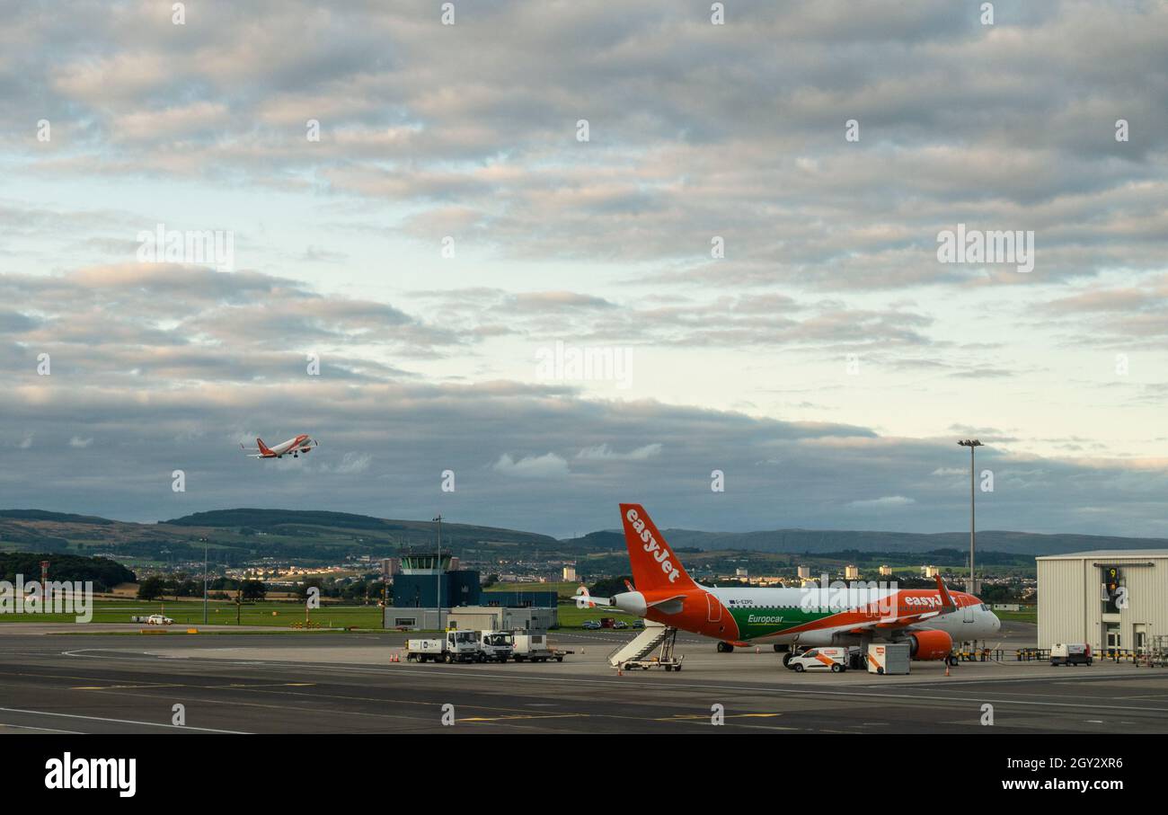 An easyJet Airbus A320-200 with a Europcar advert parked on the apron ...