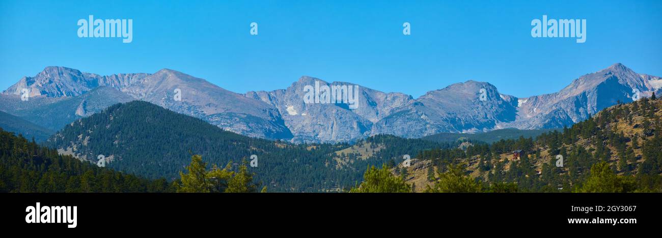 Panorama of large mountain range with hills of pine trees Stock Photo ...