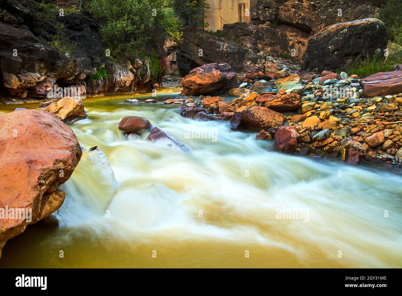 River of mineral water through red and white rocks Stock Photo - Alamy
