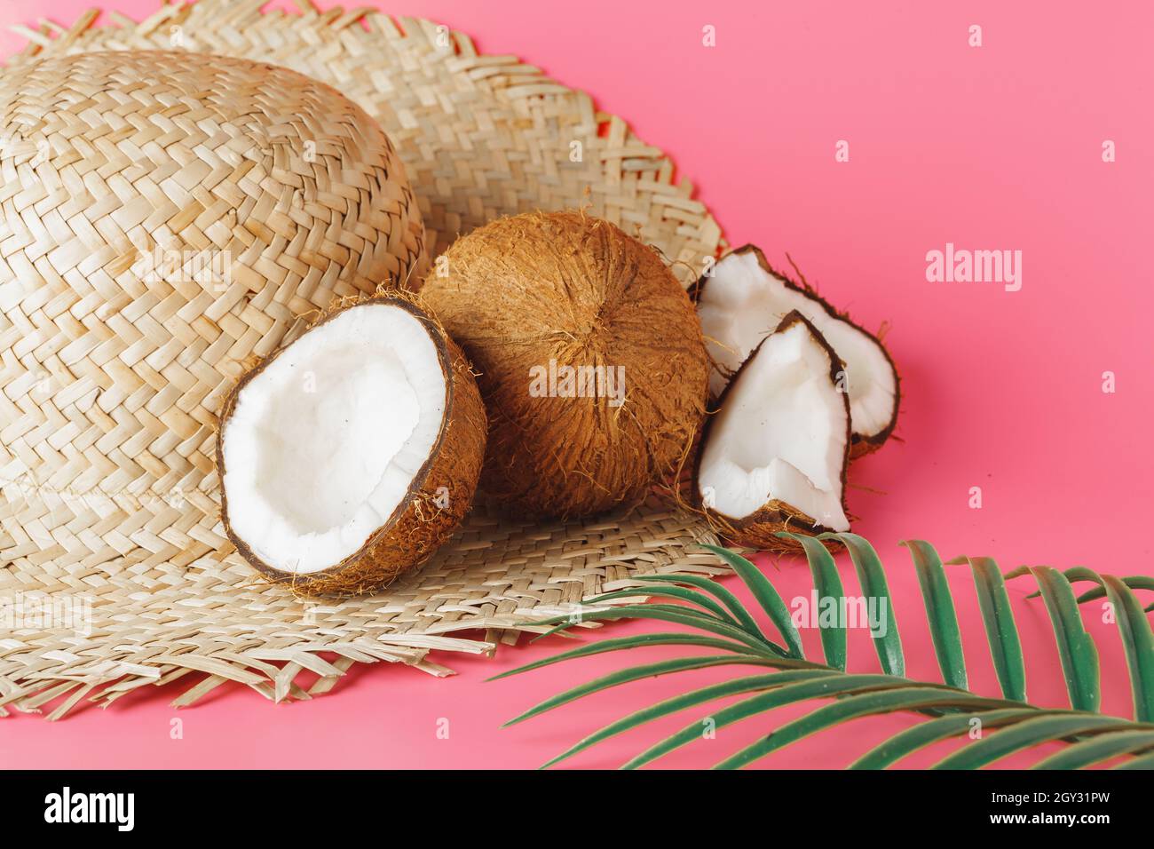 Coconut halves on a bright pink background Stock Photo - Alamy