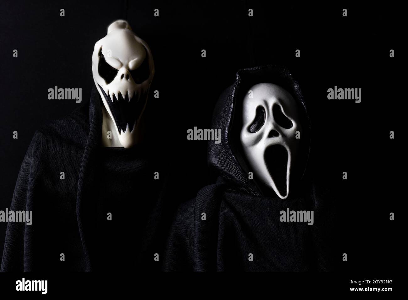 Scary halloween ghouls with scary faces on a black background Stock ...