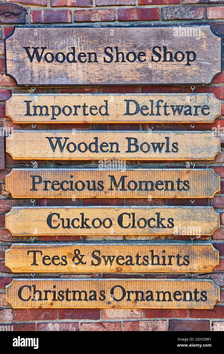 Old wall of signs in rustic dutch village on red brick background Stock ...