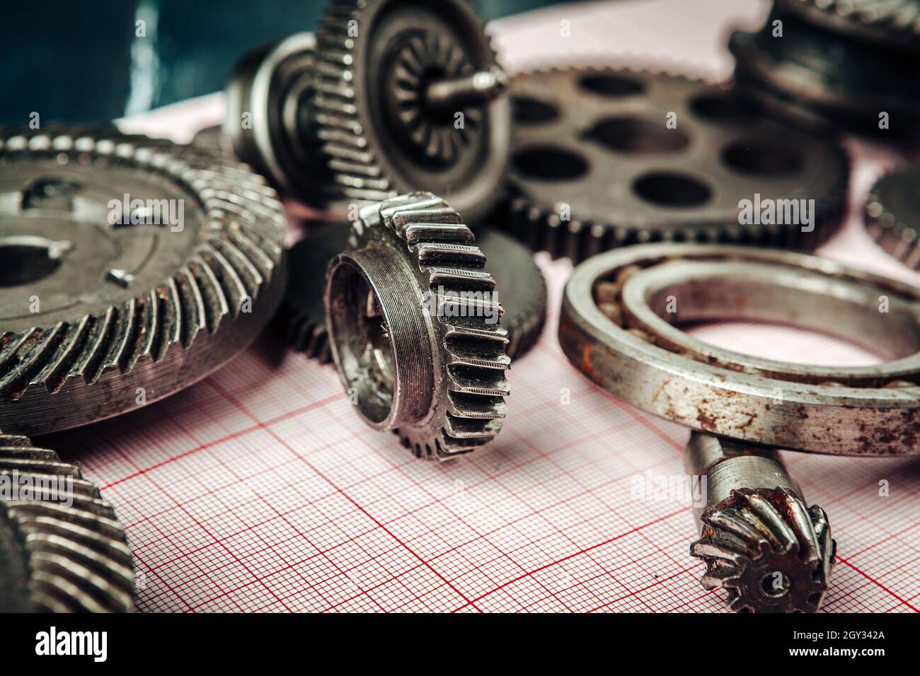 Car parts on graph paper close up. Engineering concept Stock Photo - Alamy