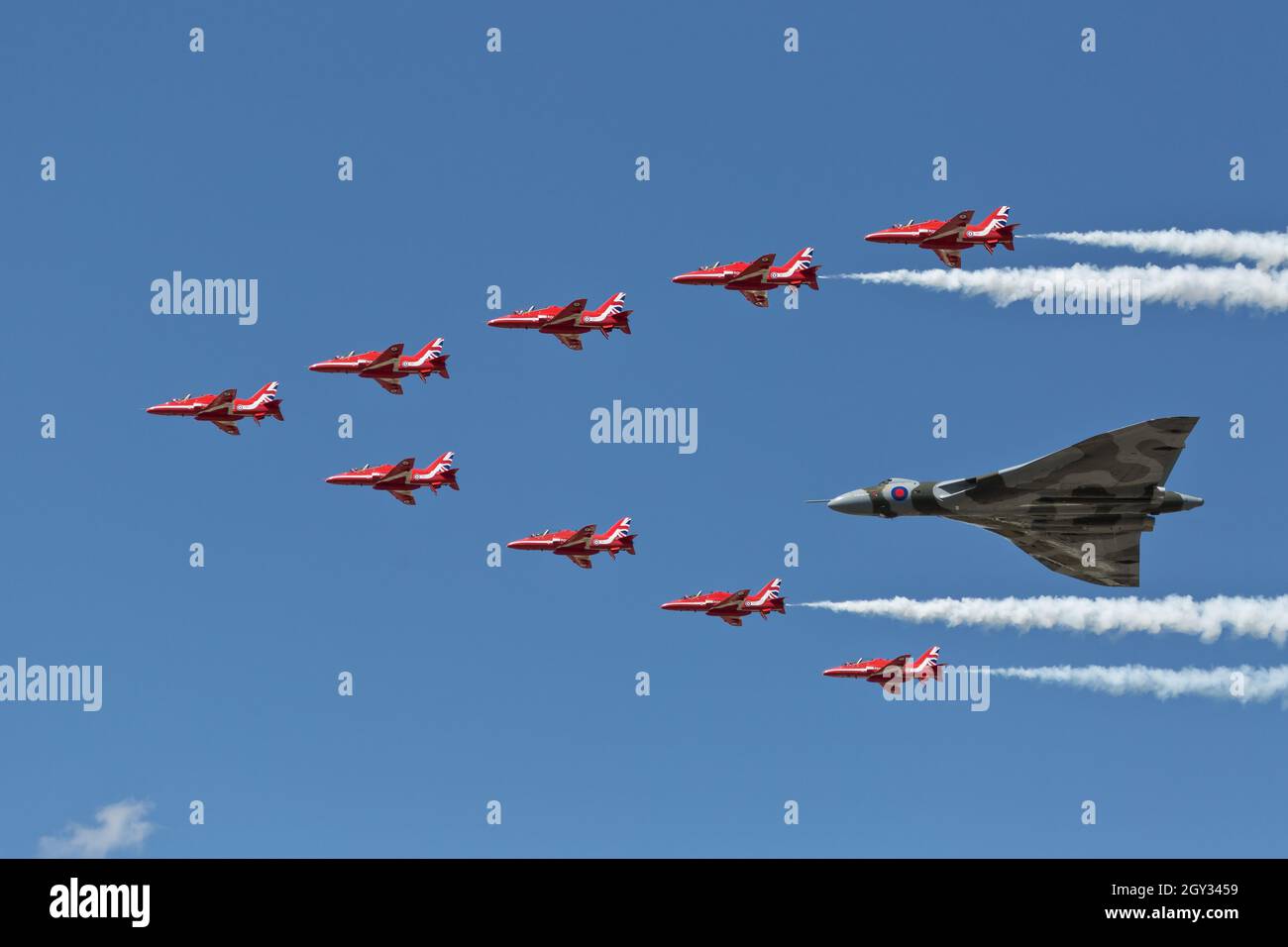 Vulcan Bomber in formation with the Red Arrows Stock Photo - Alamy