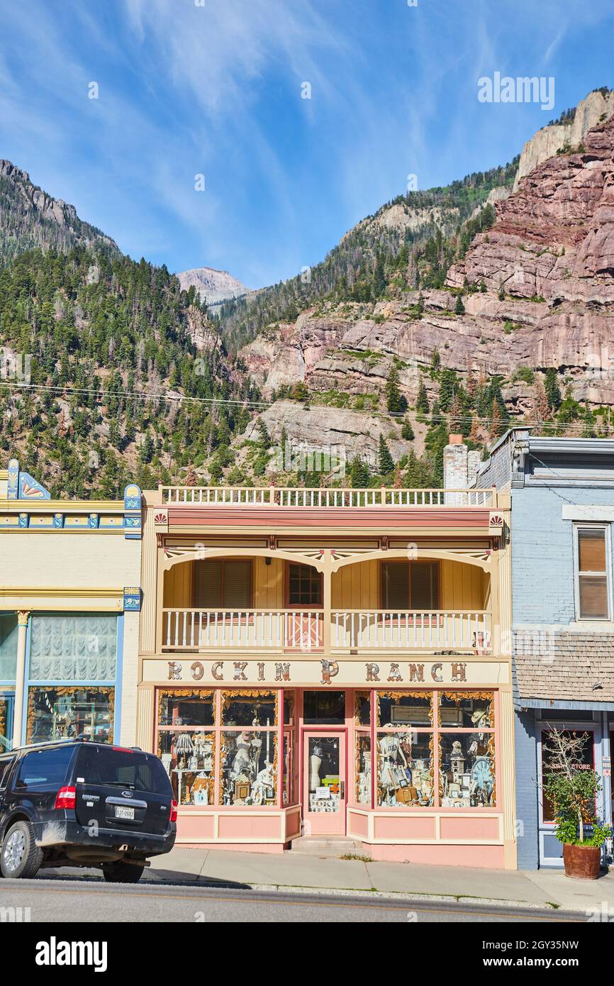 Rock shop storefront in small town with mountains in background Stock ...