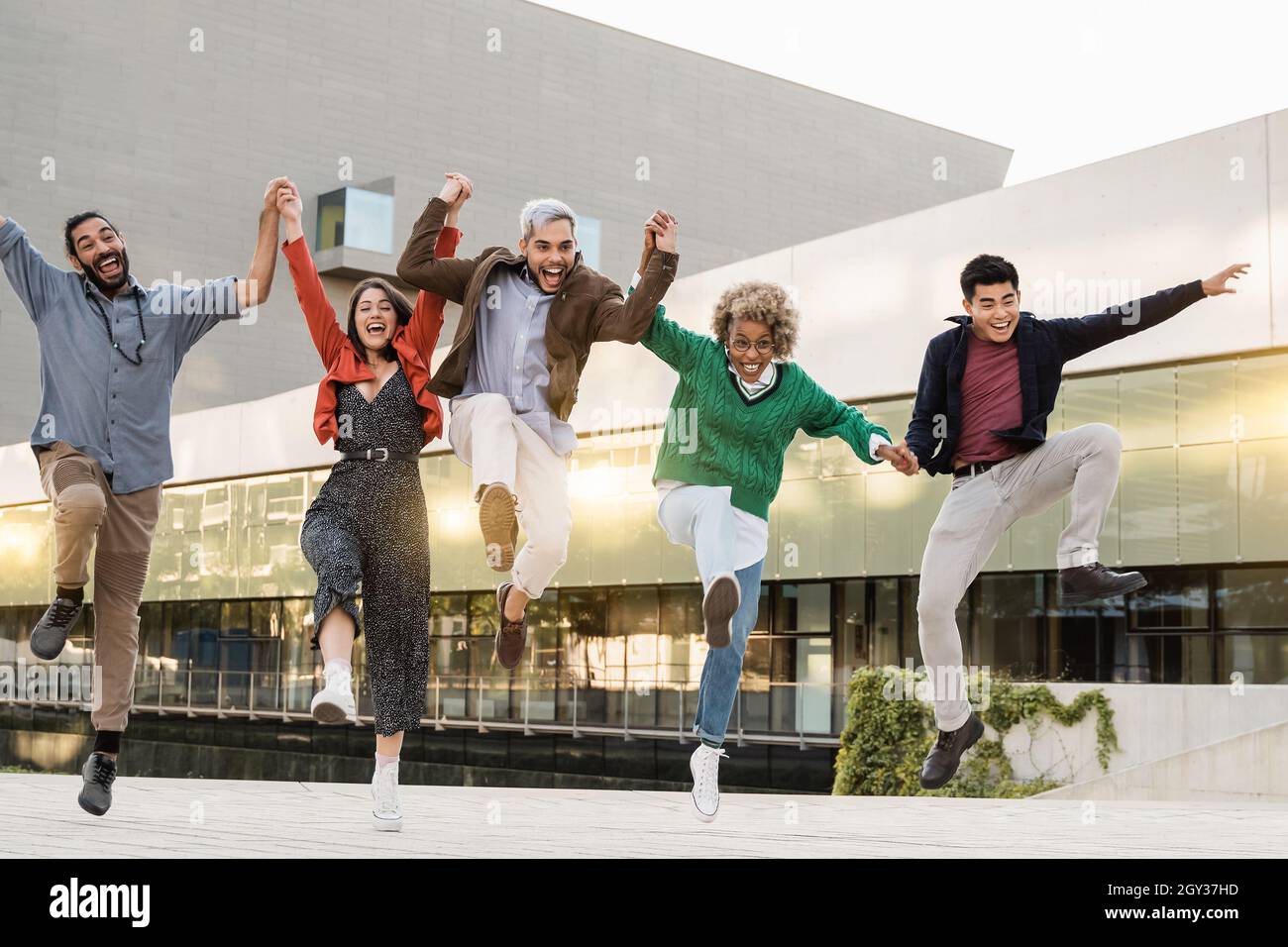 young, diverse, people, jump, multiracial, outdoor, city, friends, fun ...