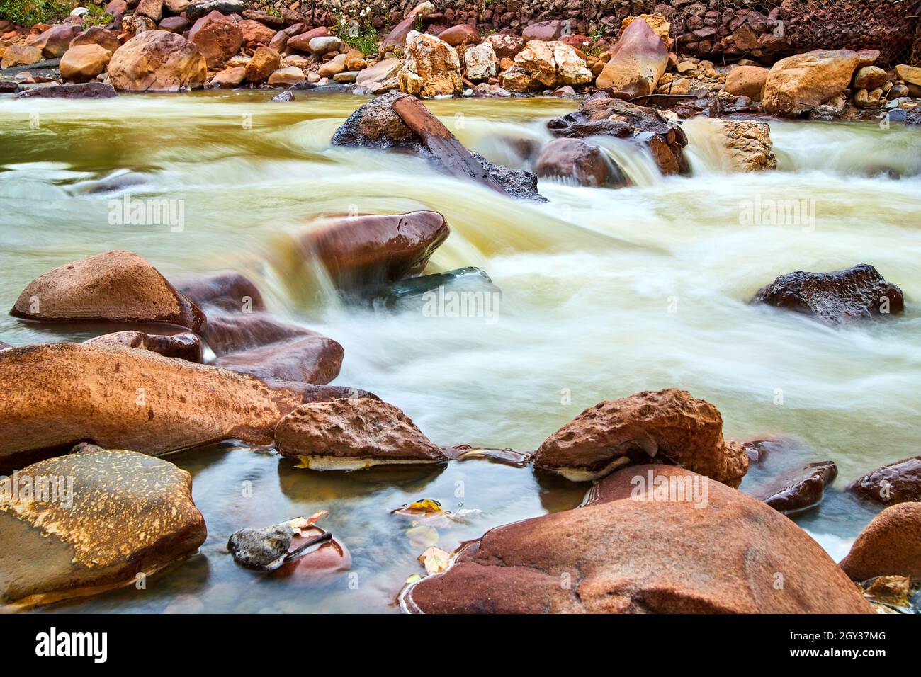 Close up of river with minerals and red rocks Stock Photo - Alamy