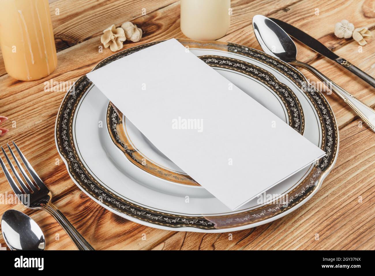 Beautiful table setting on wooden table from above Stock Photo - Alamy