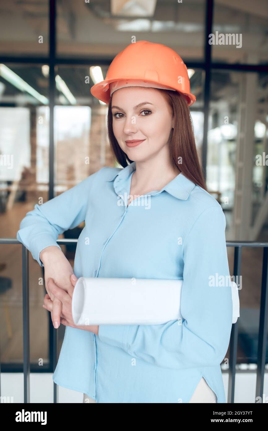 Pretty woman in safety helmet with confident look Stock Photo - Alamy
