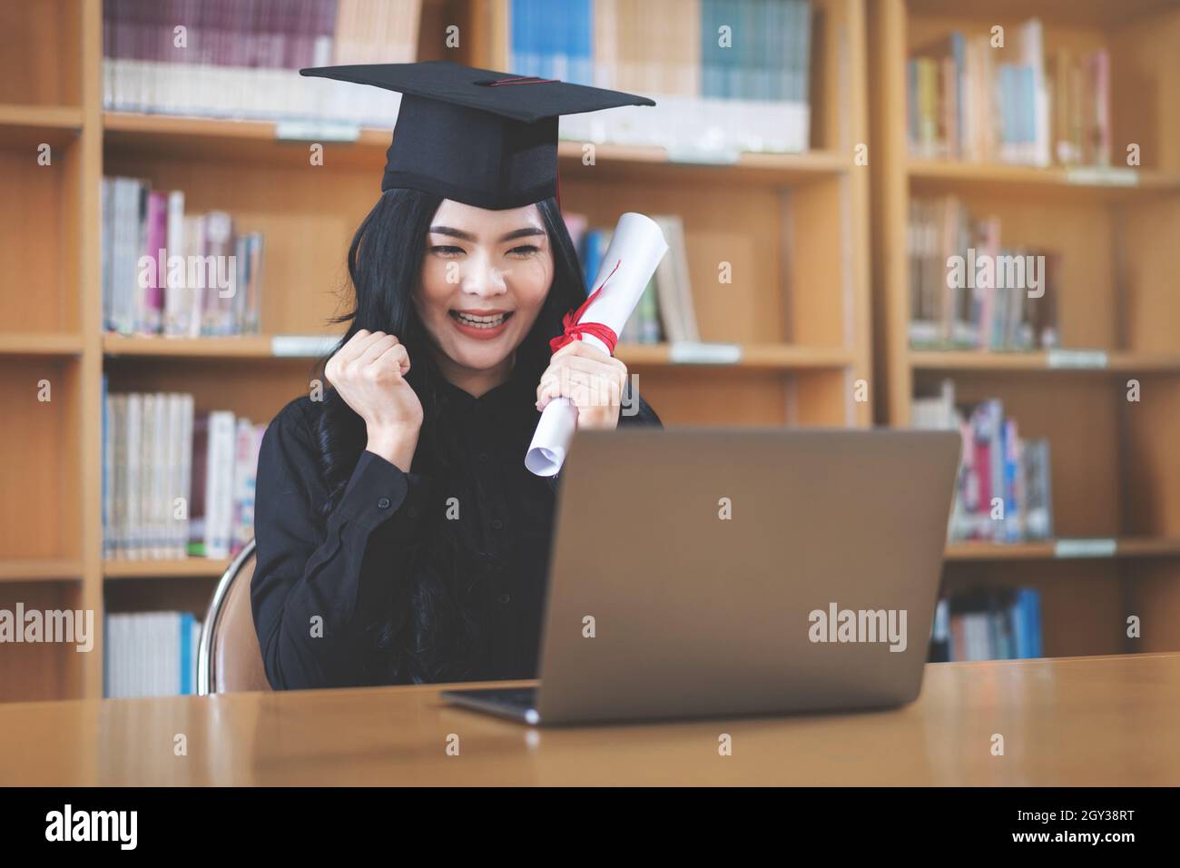Young university student expressing joy and excitement for graduation ...