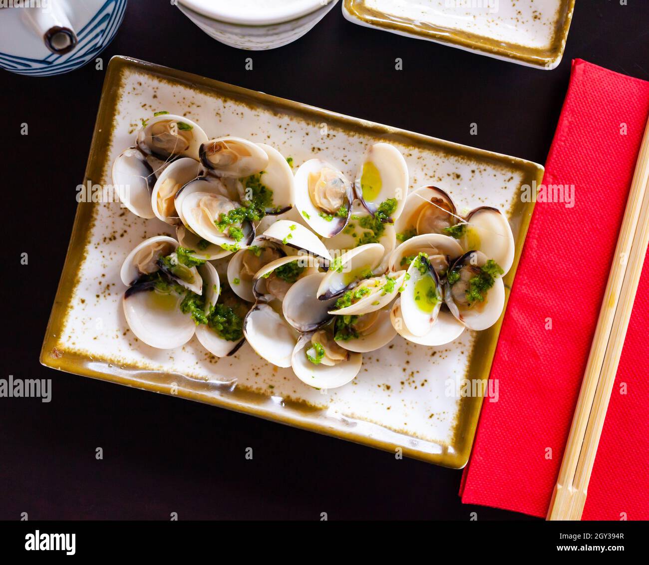Japanese sake steamed clams with ginger and green onions Stock Photo ...