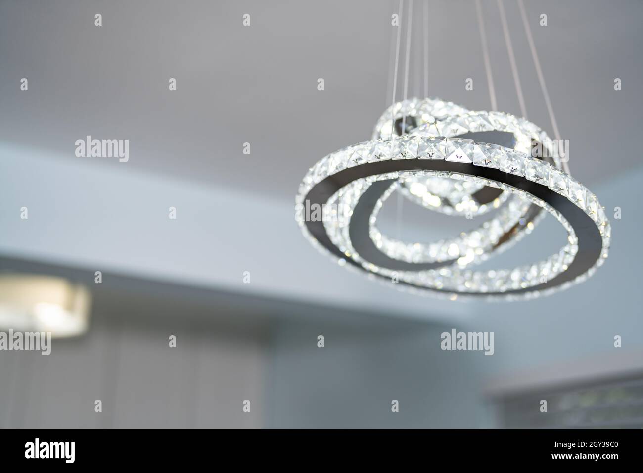 Abstract crystal chandelier hanging in a home Stock Photo - Alamy