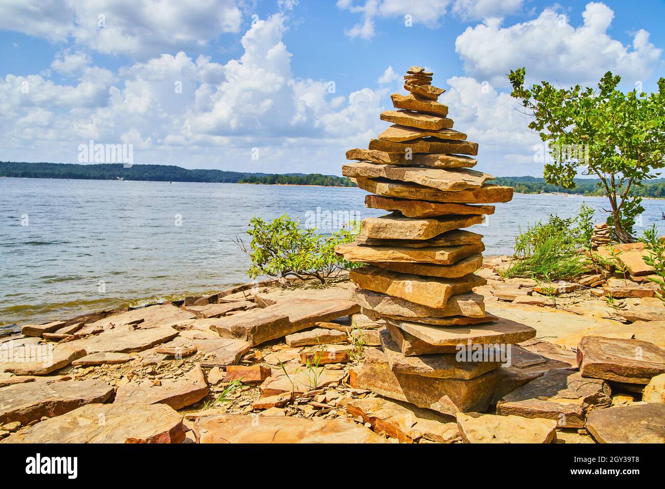 Tall and serene cairn stack of rocks on beach Stock Photo - Alamy