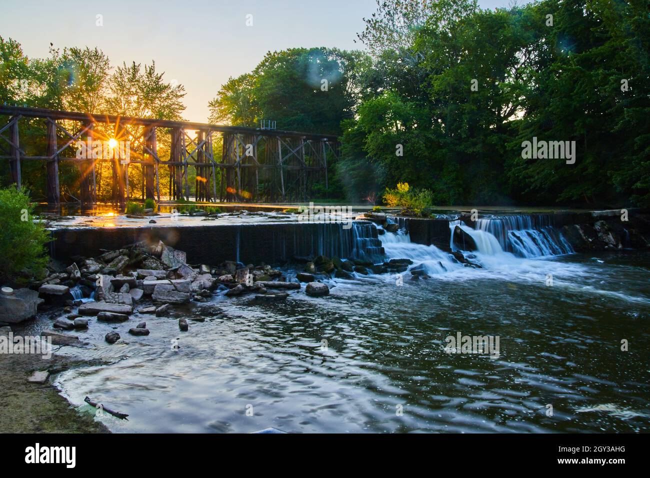 Landscape of open river near sunset or sunrise with manmade dam ...