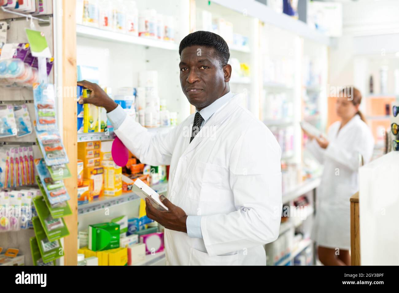 Pharmacists putting drug packages in order Stock Photo - Alamy