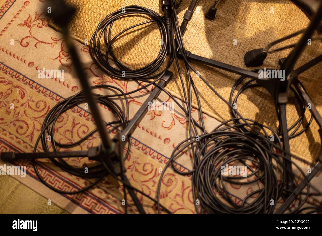 Top view of black cables on the carpet Stock Photo - Alamy