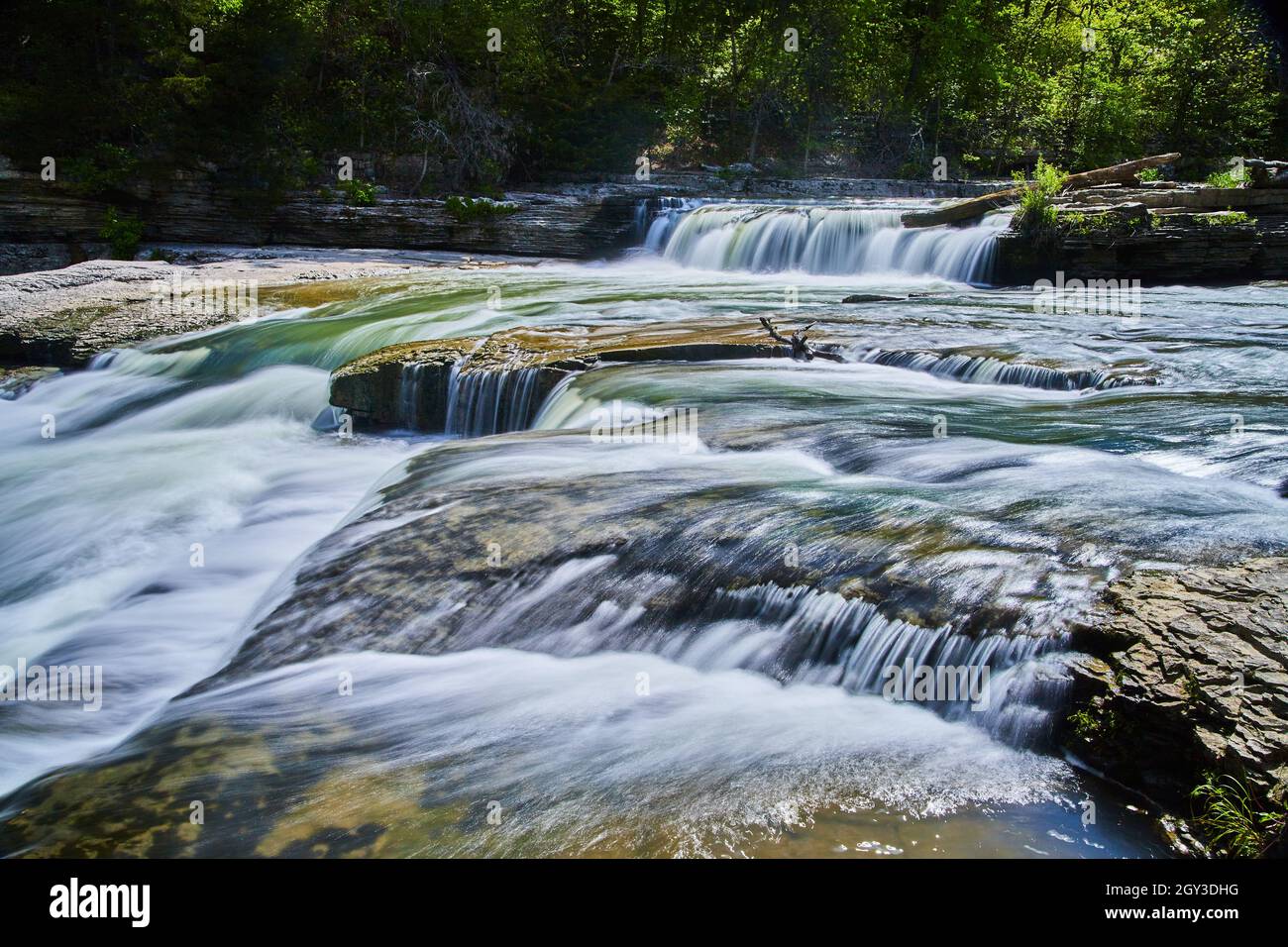 Small cascading waterfalls in river Stock Photo - Alamy