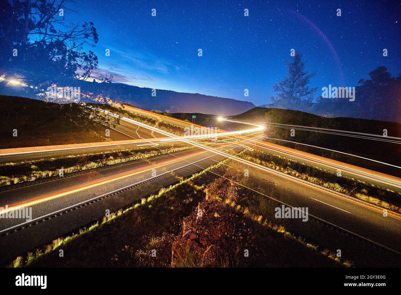 Time lapse long exposure shot of a crossroads where lots of traffic ...