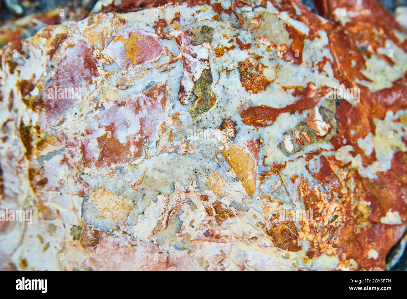 Colorful rock texture with red and blue patches Stock Photo - Alamy