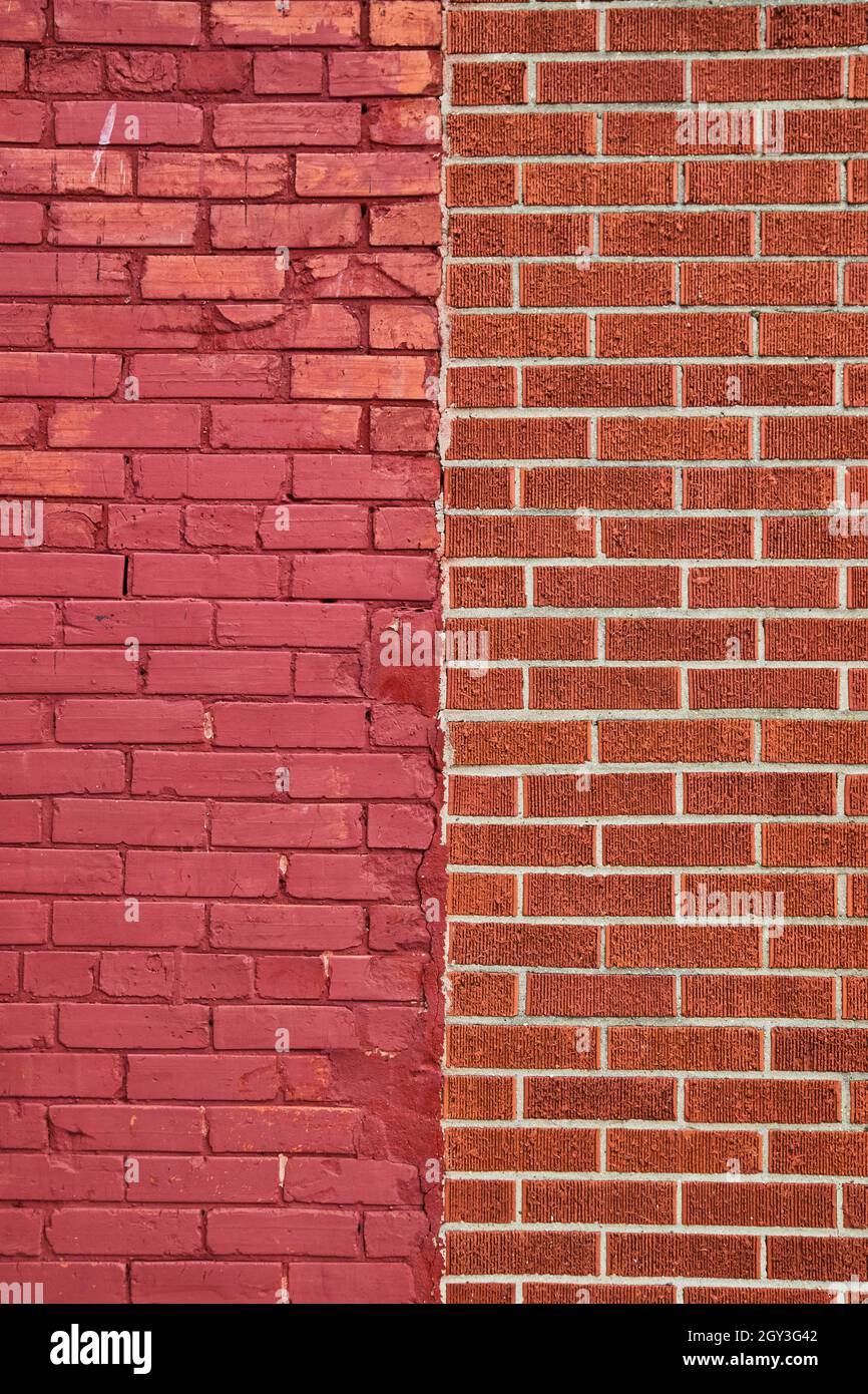 Vertical brick wall divided by two types of brick Stock Photo - Alamy