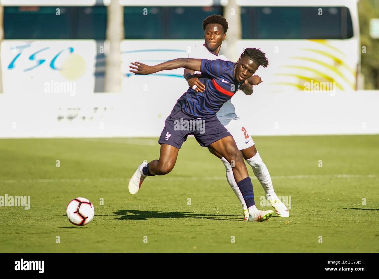 Daniel Oyegoke (white) of England, and Loum Tchaouna (blue) of France ...