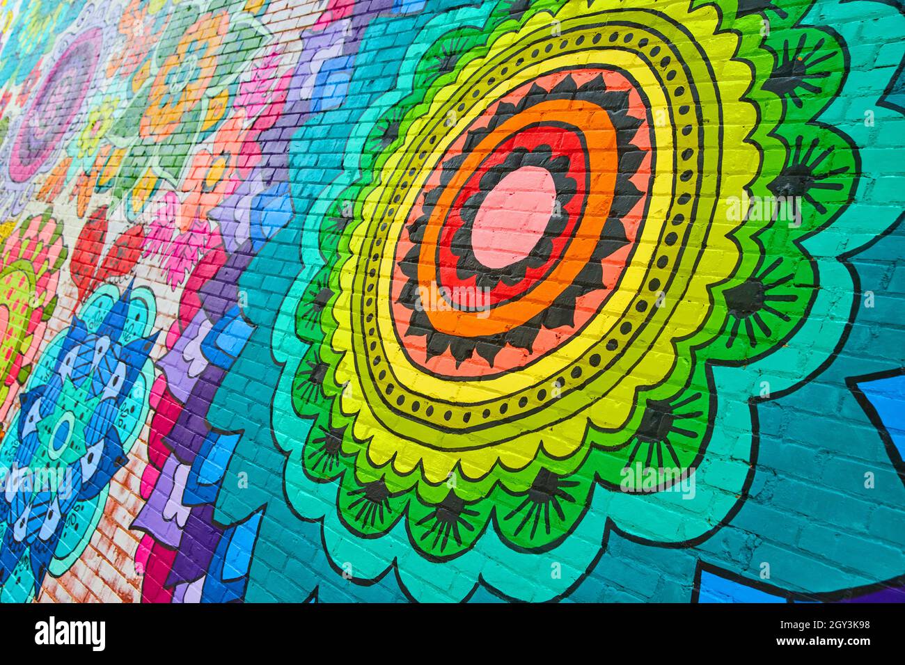 Rainbow flower painting mural on brick wall Stock Photo - Alamy