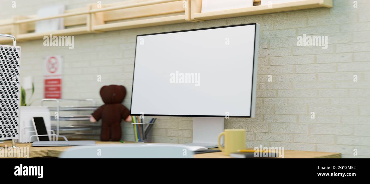Closeup computer desk in modern room space interior with blank screen ...