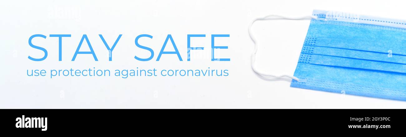 Warning sign saying "STAY SAFE - use protection against coronavi Stock ...