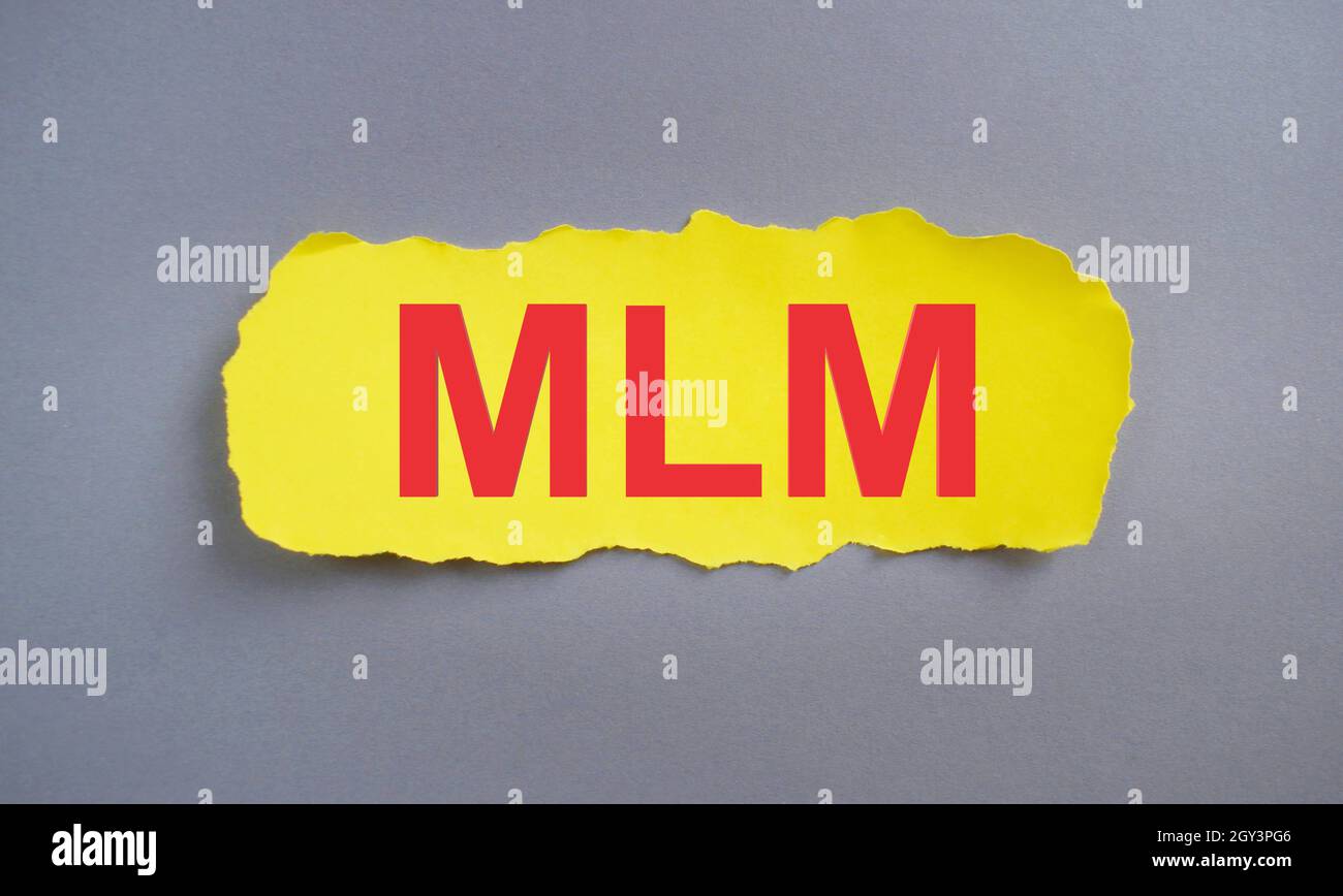 MLM Multi Level Marketing text written on yellow torn paper, Business ...