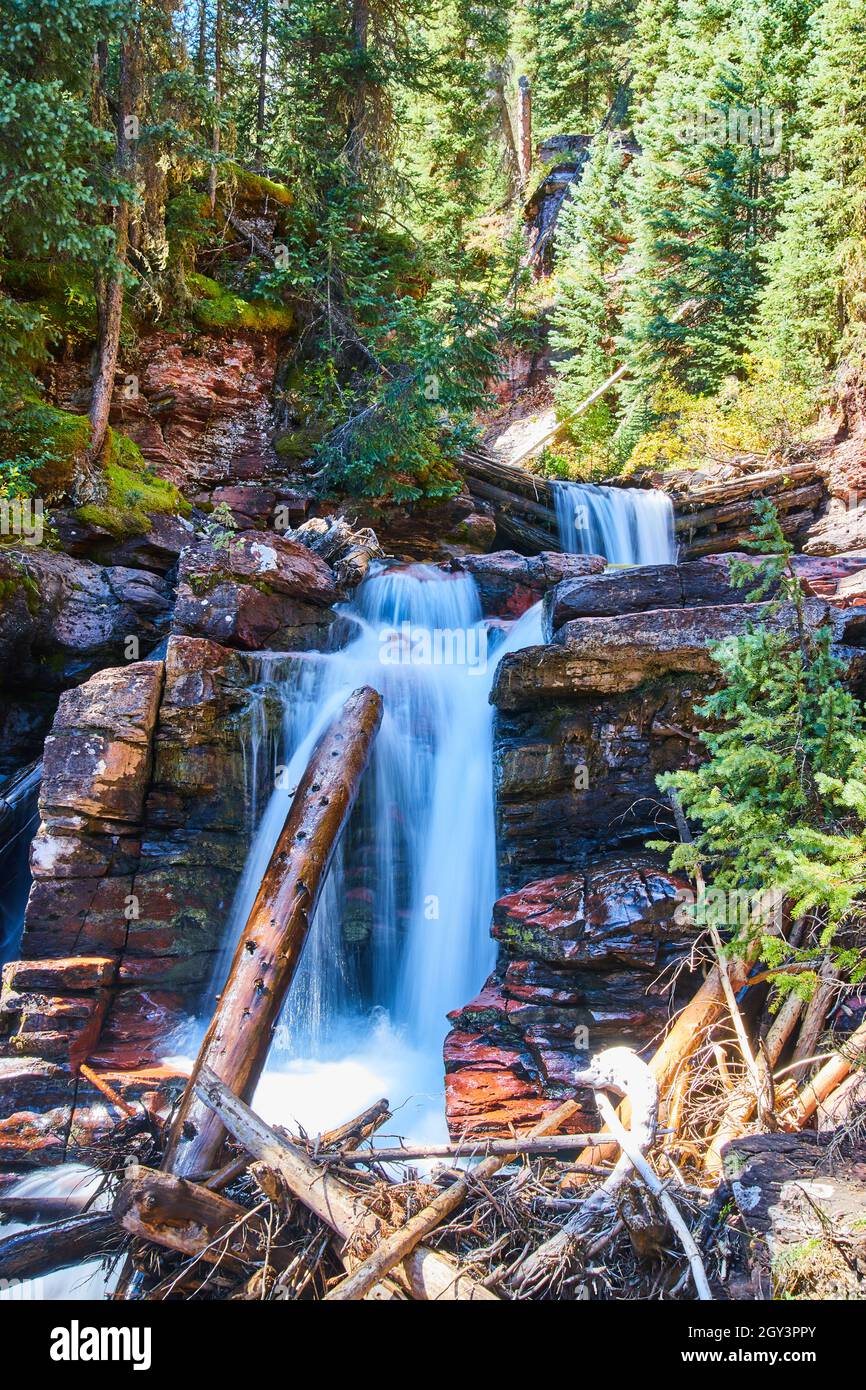 Colorful canyon with logs holding back waterfalls Stock Photo - Alamy