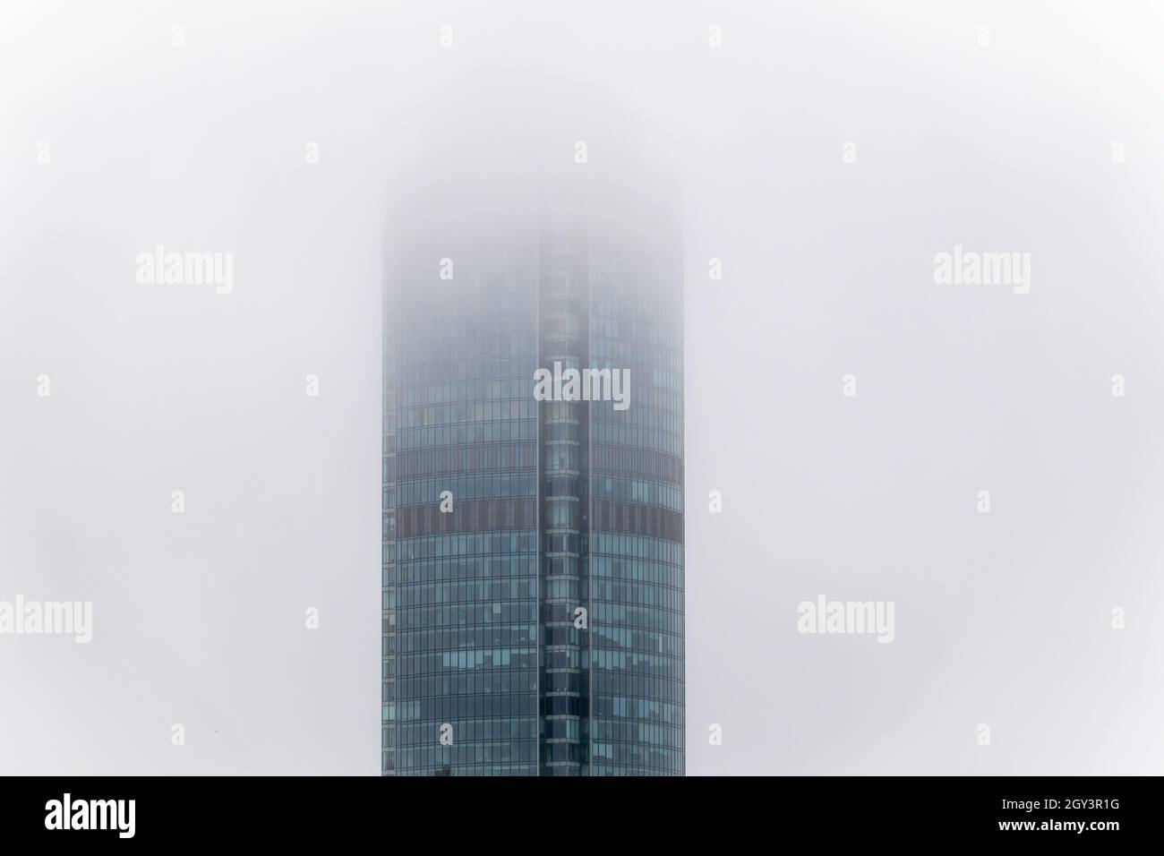 The modern Skyscraper is hidden in the fog. Hiding in the Fog Stock ...