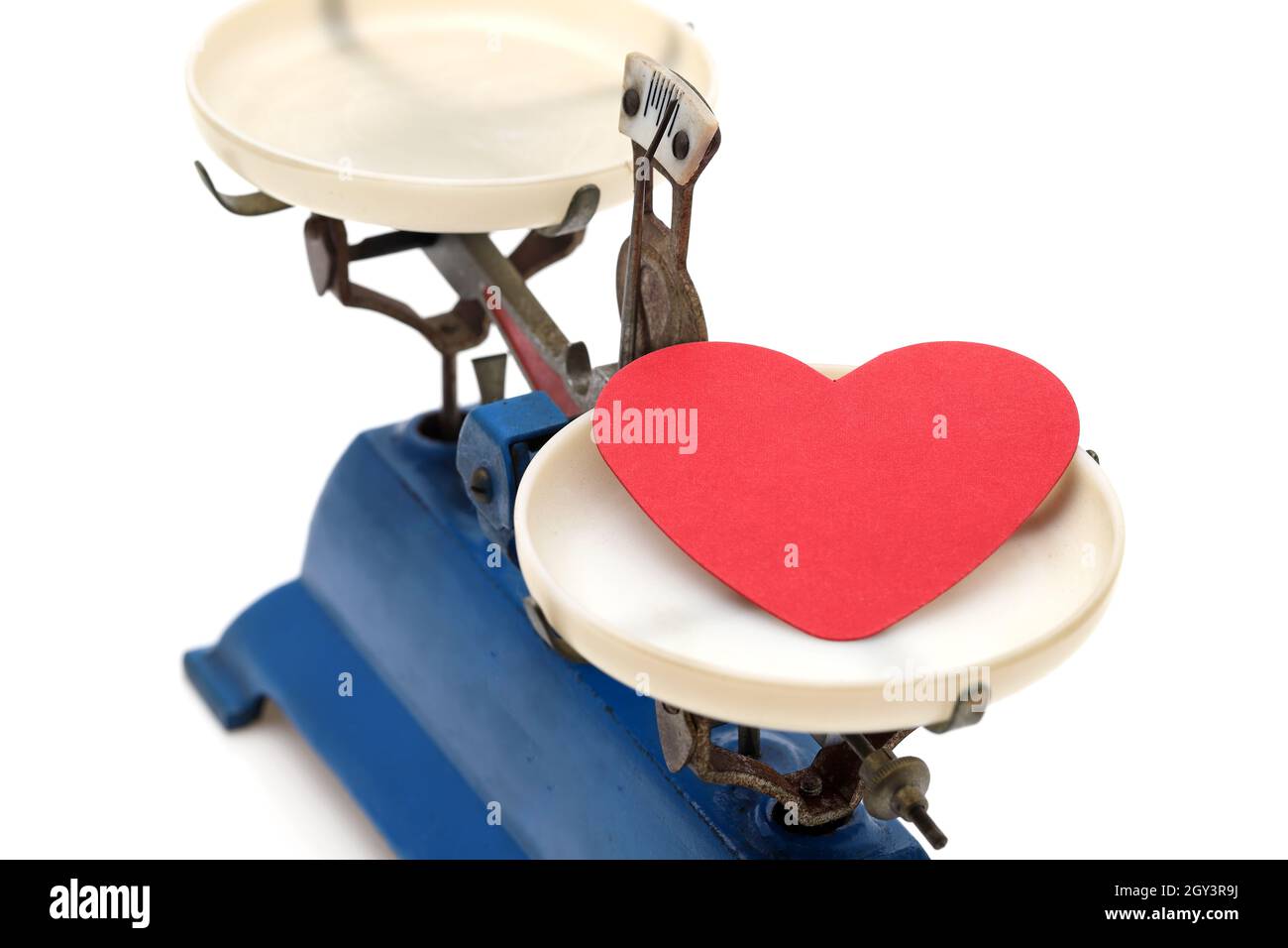 Retro roberval balance with red heart, scale on a white background ...