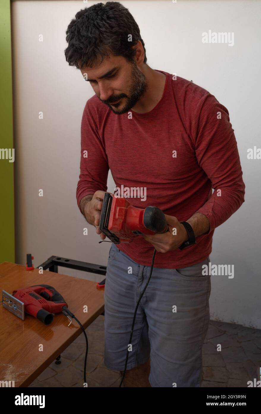 man using power tools Stock Photo - Alamy