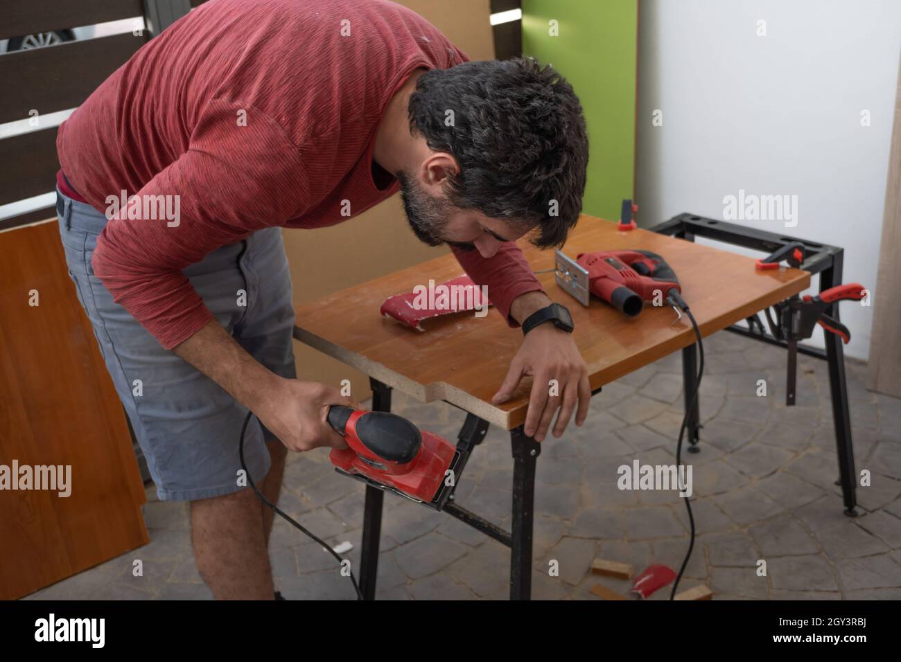 man using power tools Stock Photo - Alamy