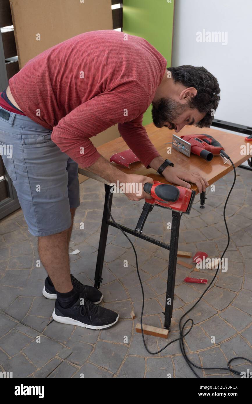 man using power tools Stock Photo - Alamy