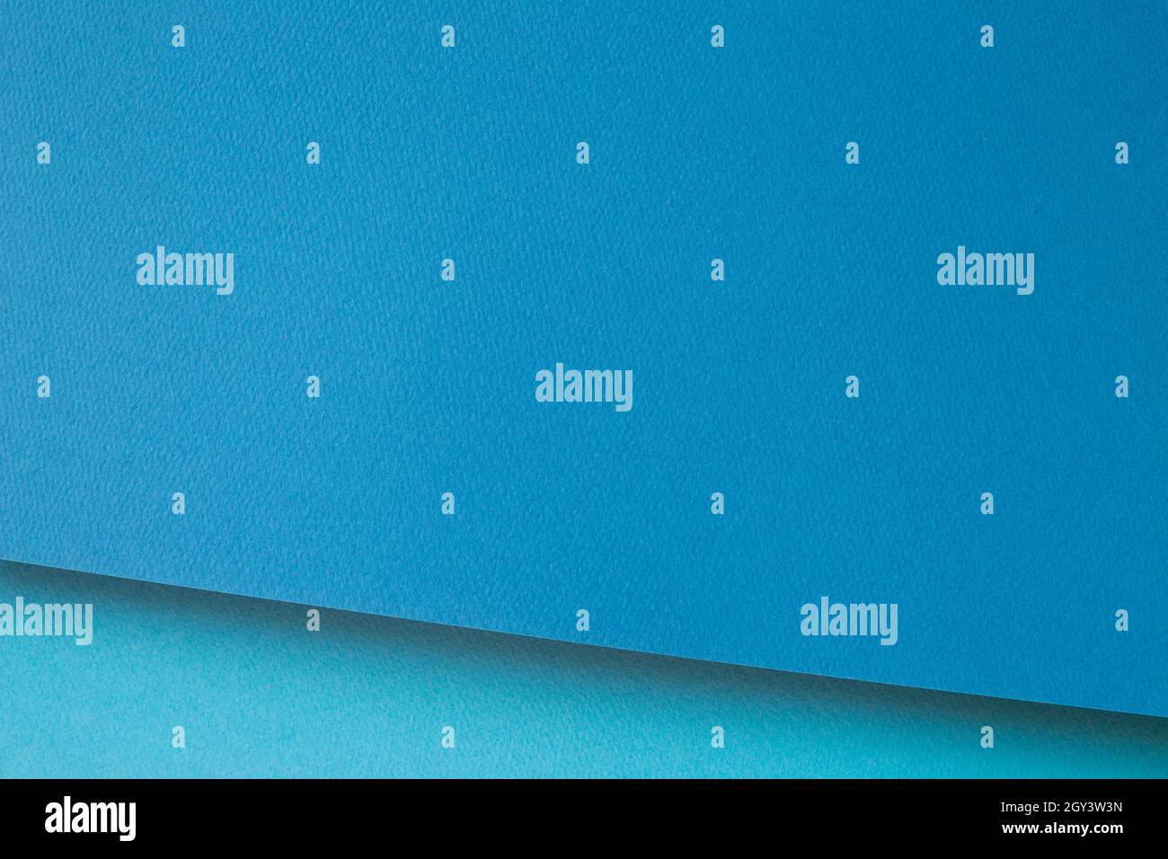 Abstract blue layered color paper background Stock Photo - Alamy