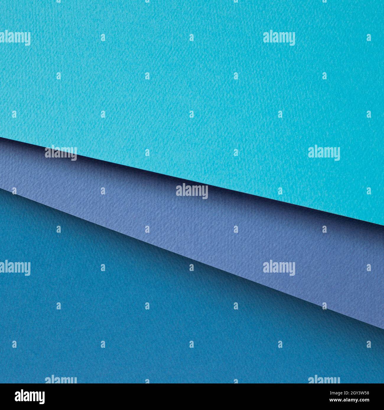 Abstract blue layered color paper background Stock Photo - Alamy