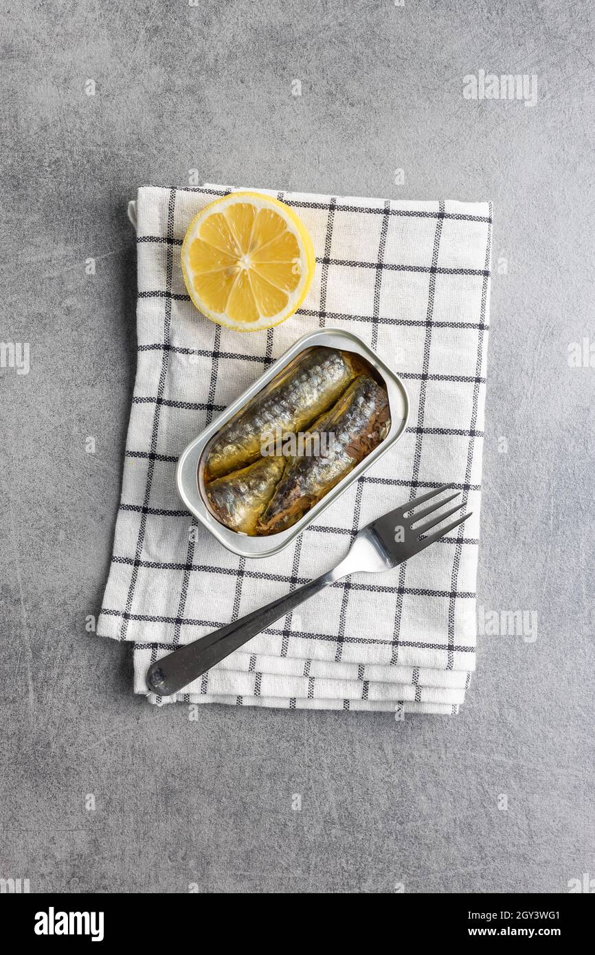 Canned sardines. Sea fish in tin can on kitchen table. Top view Stock ...