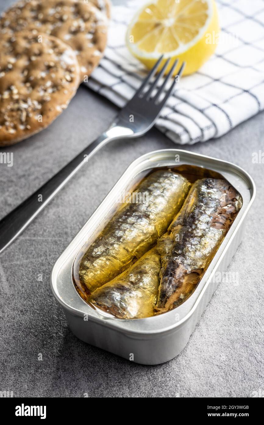 Canned sardines. Sea fish in tin can on kitchen table Stock Photo - Alamy