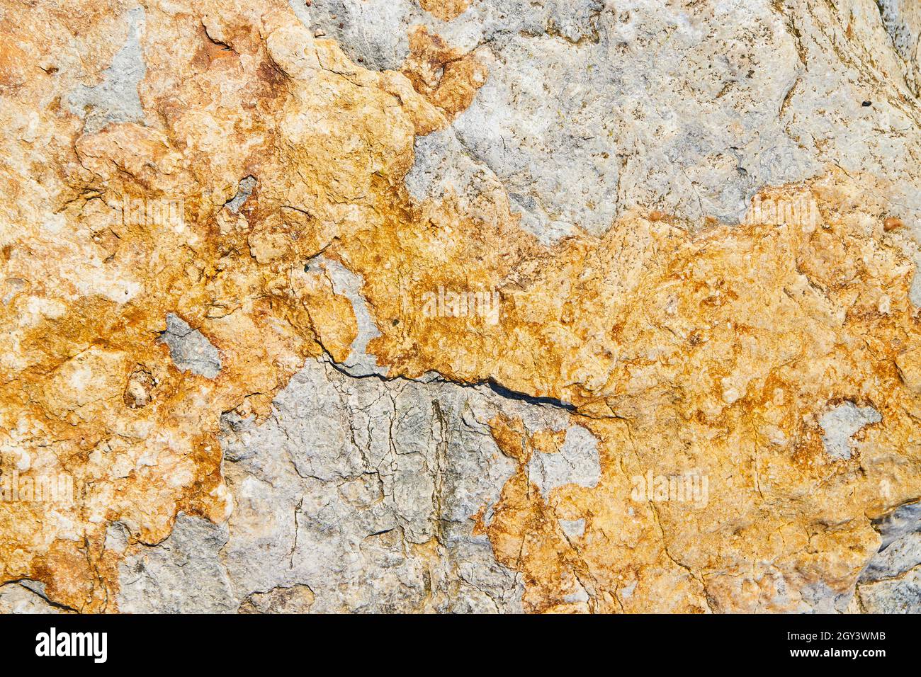 Texture of stone surface up close with grey and yellow colors Stock ...
