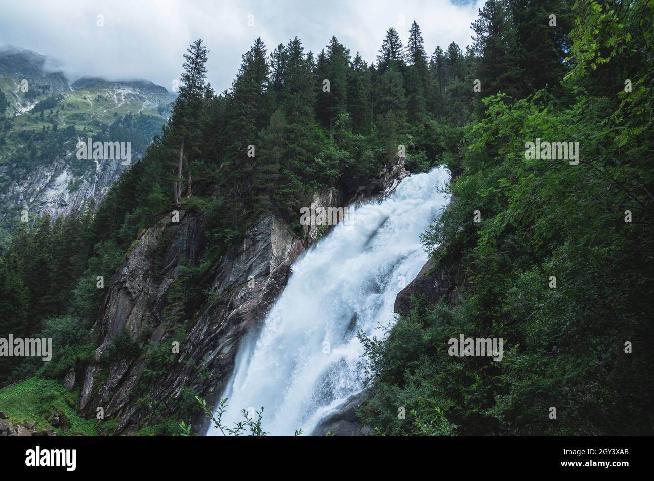 Big waterfall in the austrian alps Stock Photo - Alamy