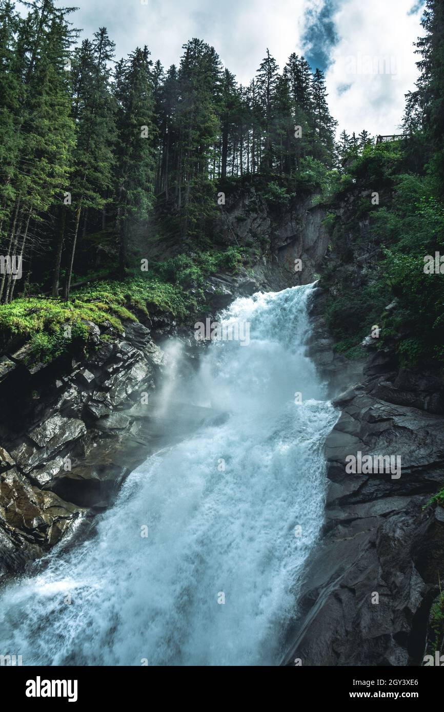 Big waterfall in the austrian alps Stock Photo - Alamy
