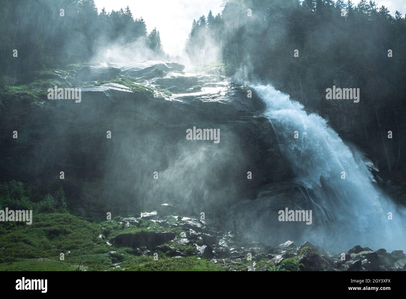 Big waterfall in the austrian alps Stock Photo - Alamy