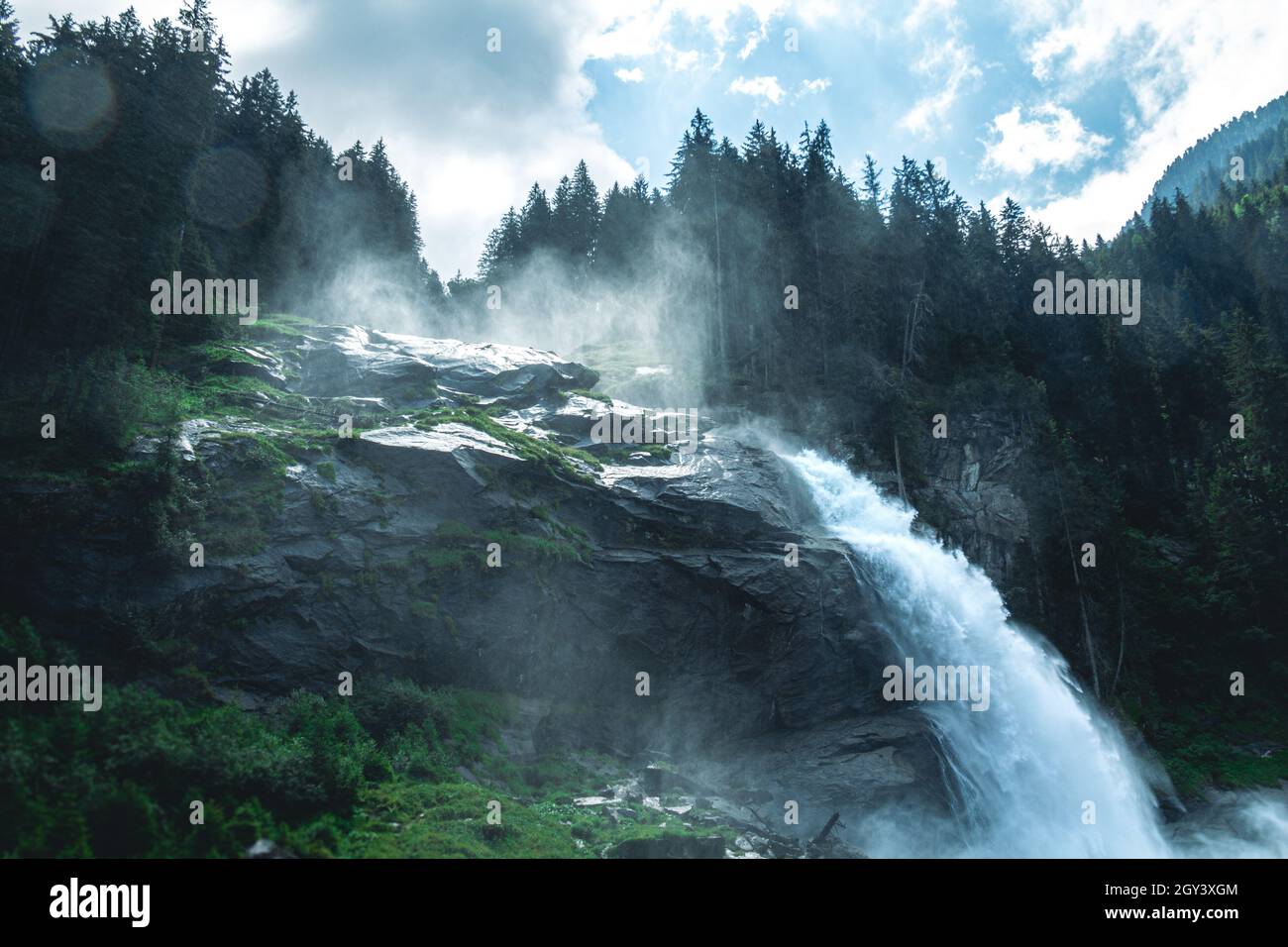 Big waterfall in the austrian alps Stock Photo - Alamy