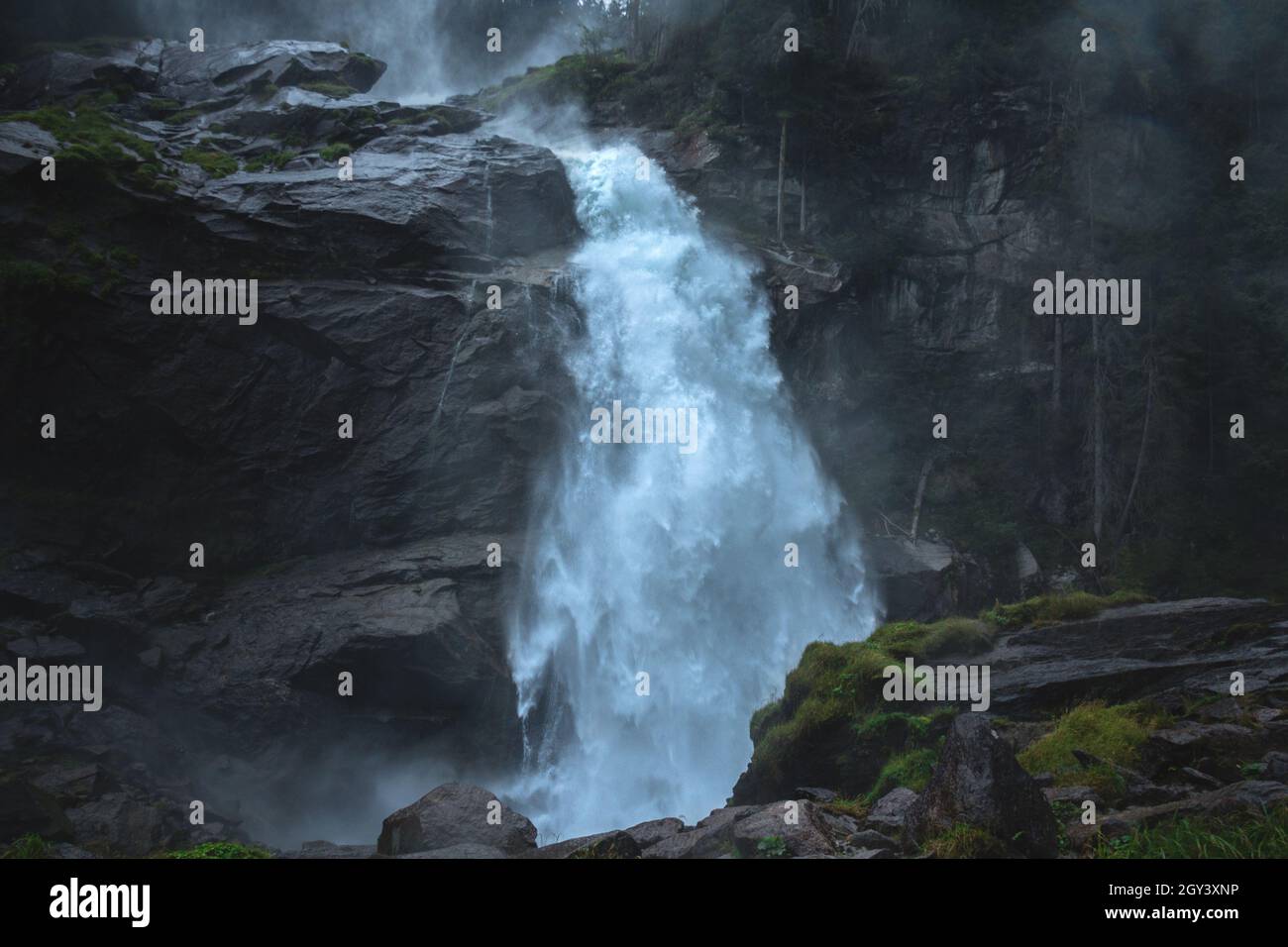 Big waterfall in the austrian alps Stock Photo - Alamy