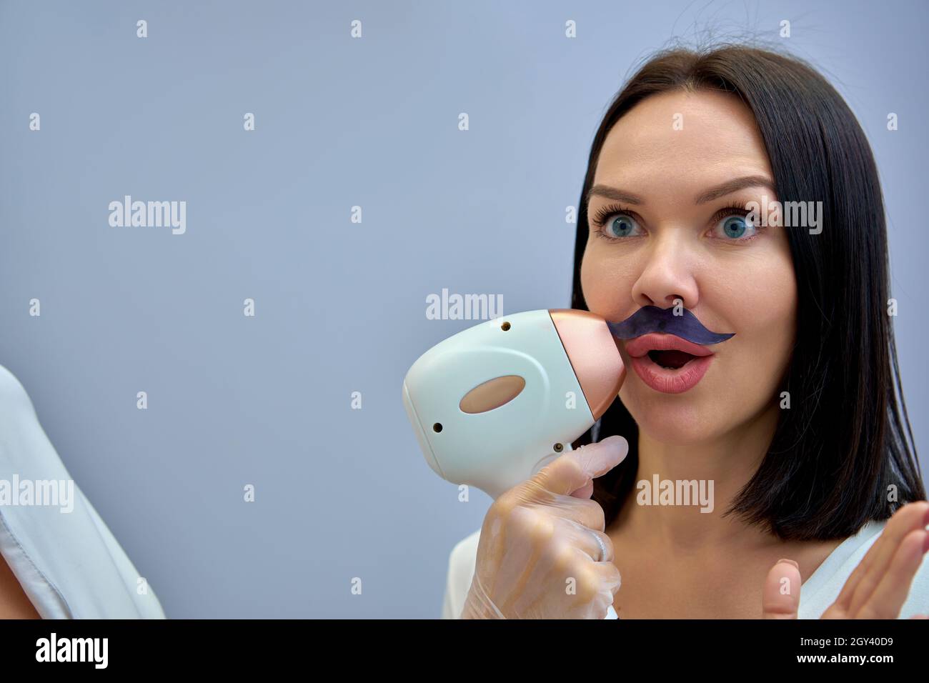 Laser epilation and cosmetology in beauty salon. Hair removal procedure ...