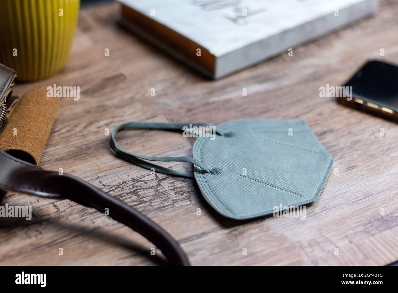Desktop with face masks on top and office elements Stock Photo - Alamy